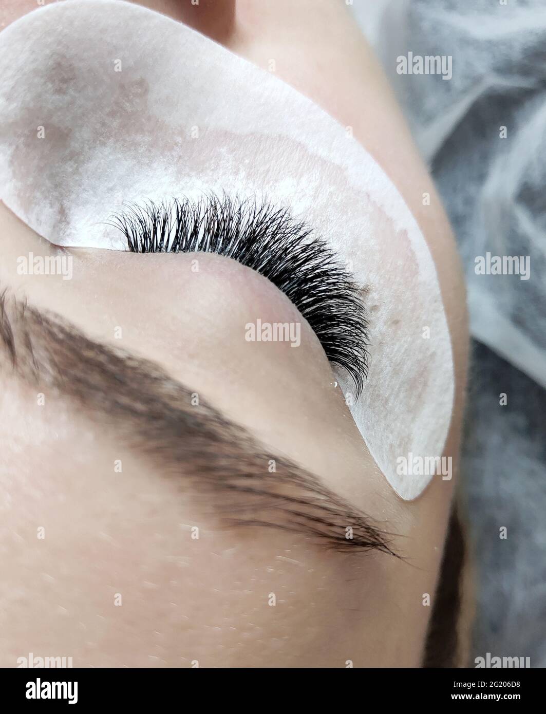 Lash extensions in beauty salon macro eye top view Stock Photo - Alamy