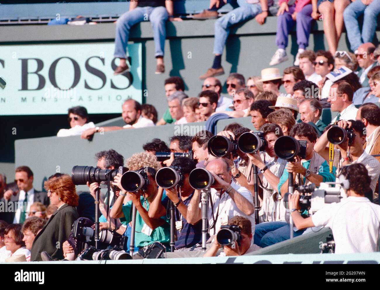 The photographers at the tennis match, 1990s Stock Photo - Alamy