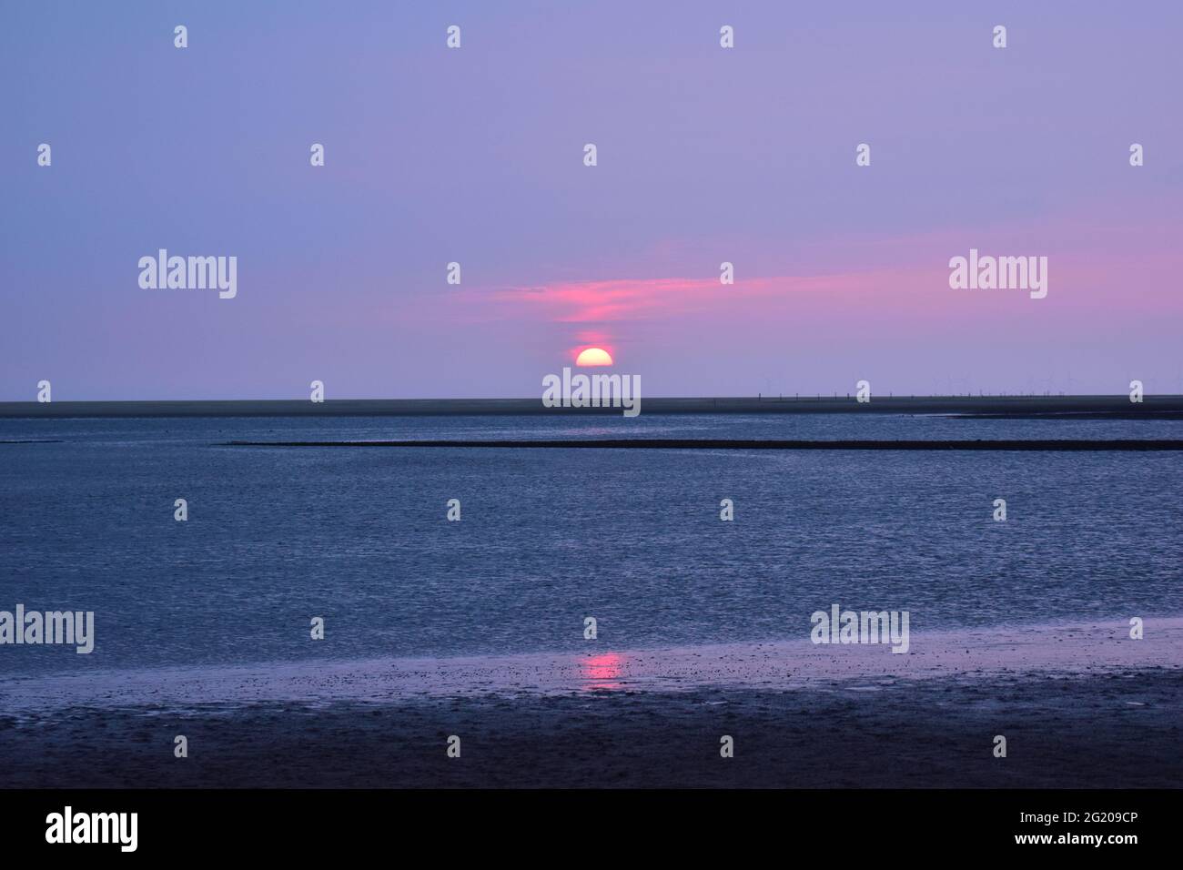 Beautiful view of sunset at the beach Stock Photo - Alamy