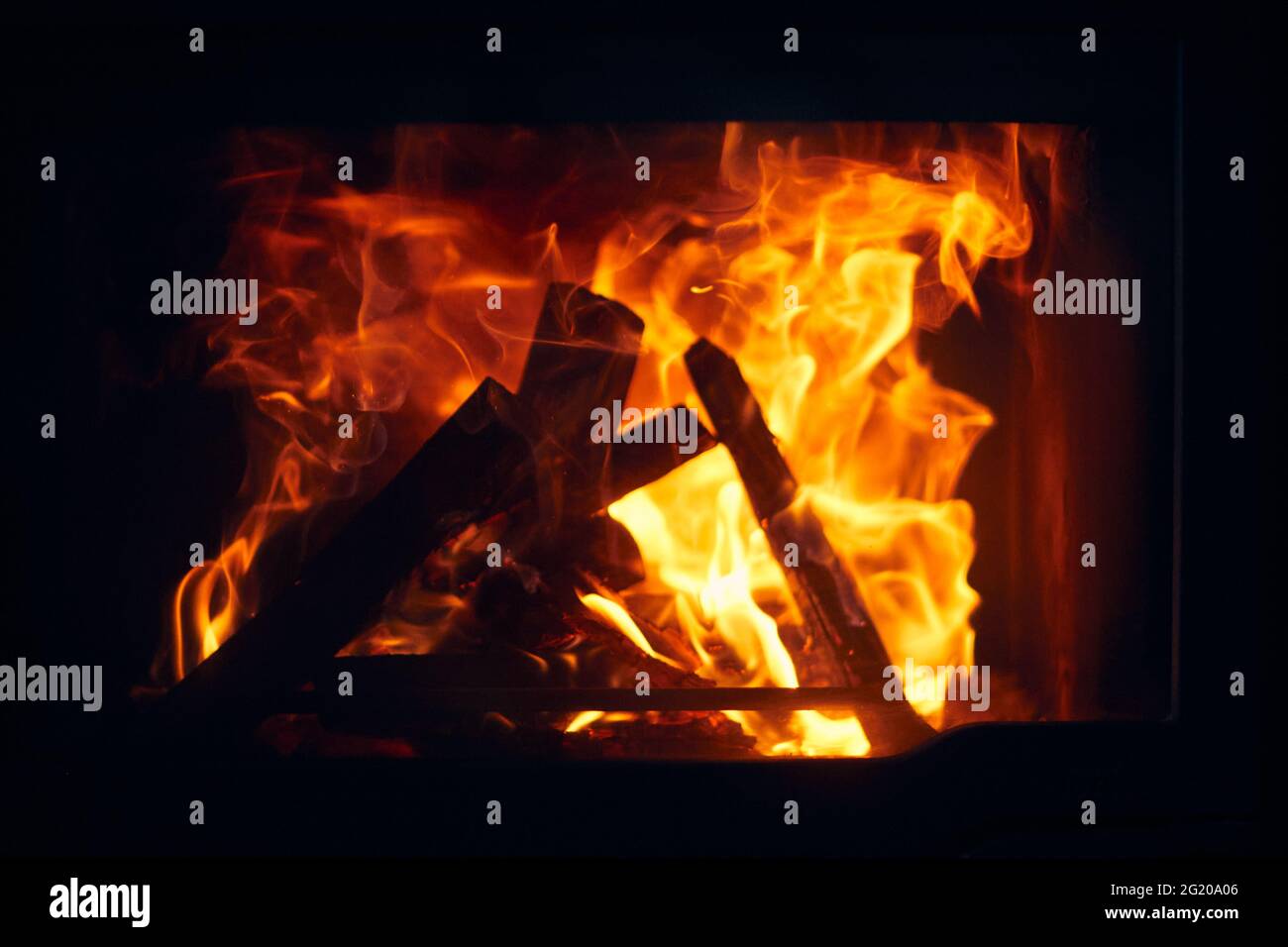 A fire burns in a fireplace, Fire to keep warm Stock Photo - Alamy