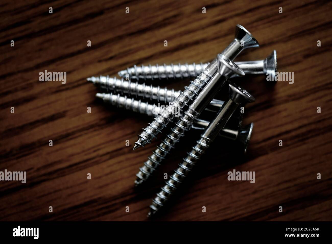 Screws pile of on wood tabletop workbench work bench for fixing Stock ...