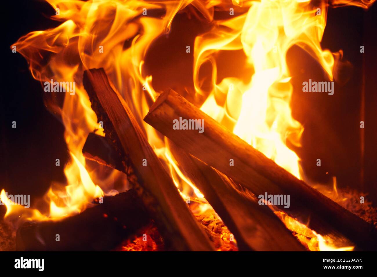 A fire burns in a fireplace, Fire to keep warm Stock Photo - Alamy