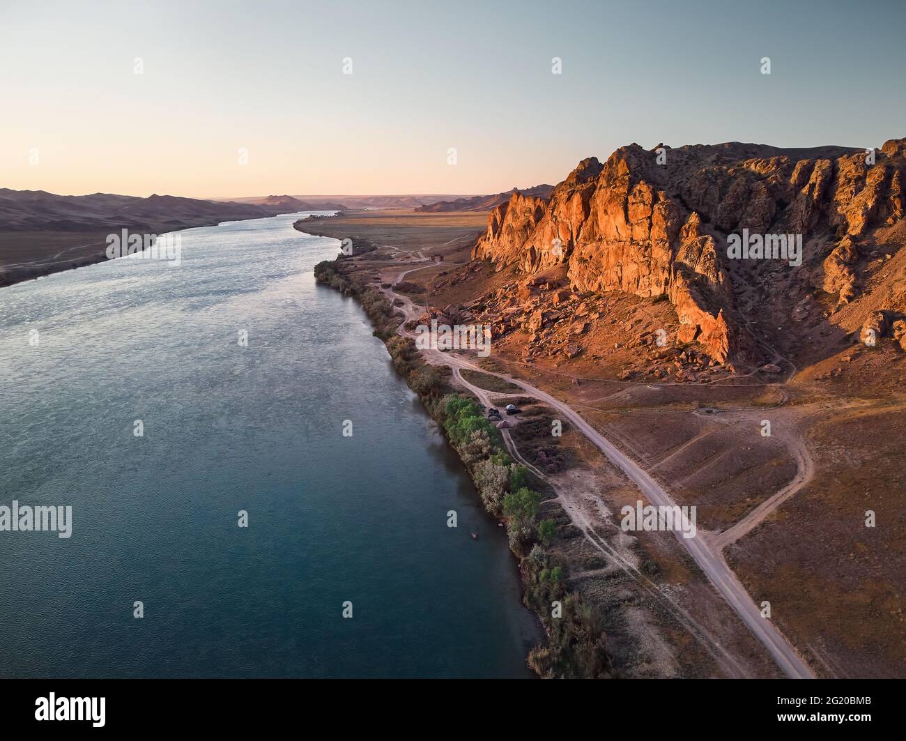 Aerial drone shot of river Ili and desert rock mountains in national ...