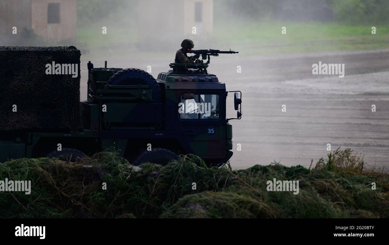 Munster, Germany. 02nd June, 2021. A Bundeswehr soldier stands by his ...