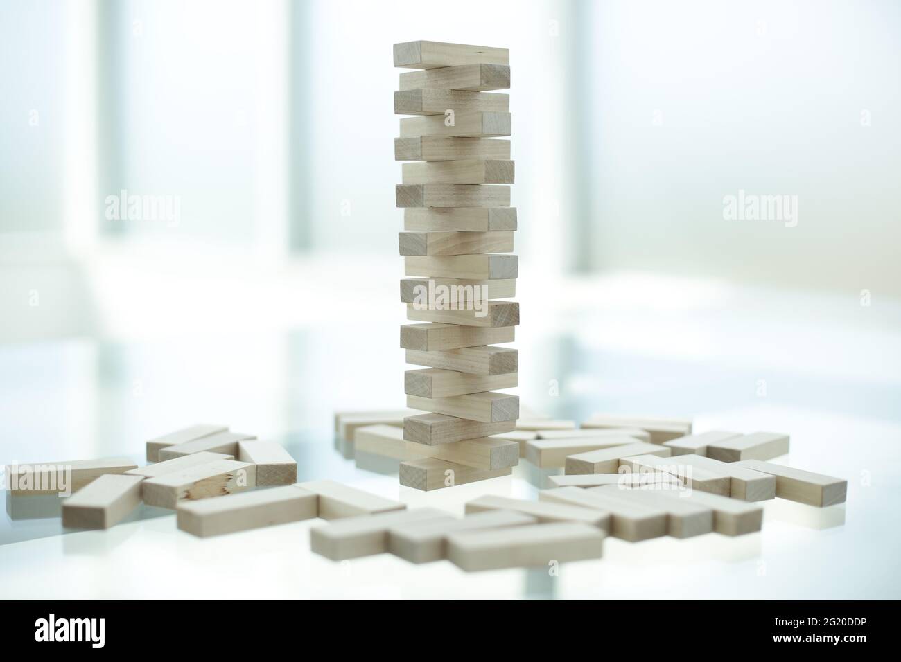Wood Jenga on glass table Stock Photo - Alamy