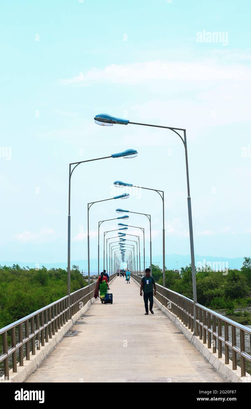 Pier or jetty, footpath promenade, and sea at sunrise. Beautiful view ...