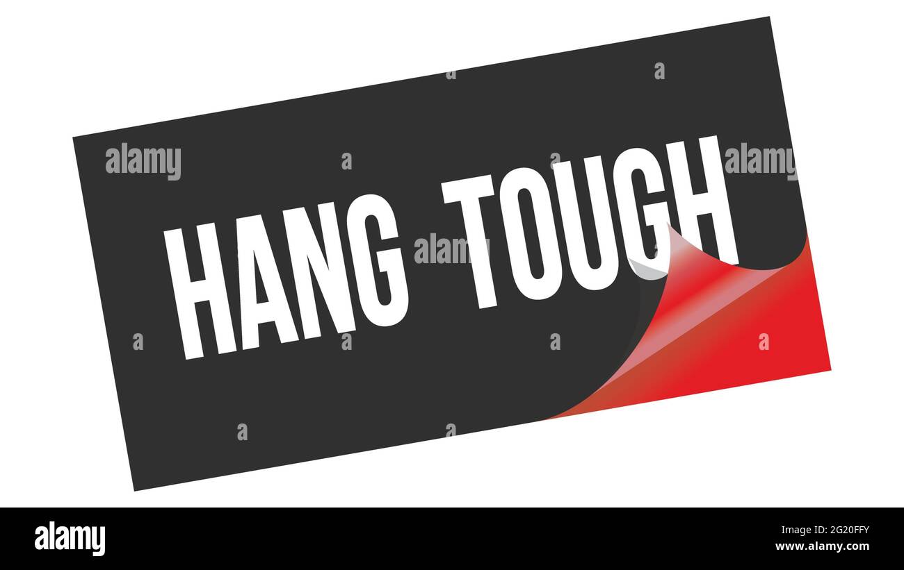 HANG TOUGH text written on black red sticker stamp Stock Photo - Alamy