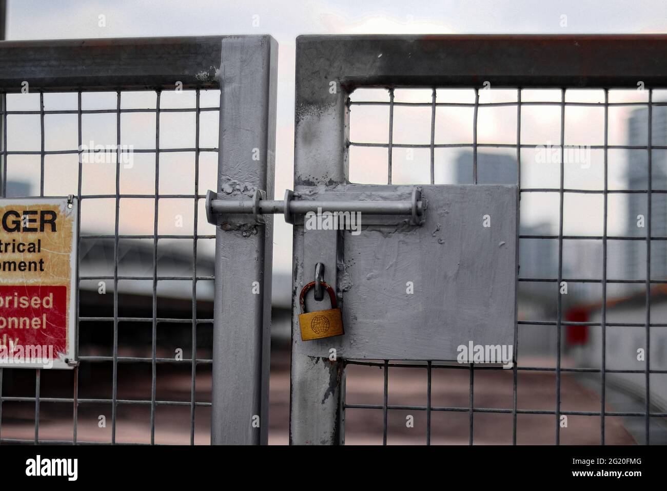 SINGAPORE, SINGAPORE - Mar 11, 2021: Locked and rusted padlock on a ...