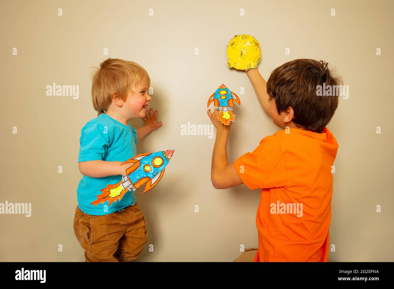 Two brothers play spaceship and rockets together Stock Photo - Alamy