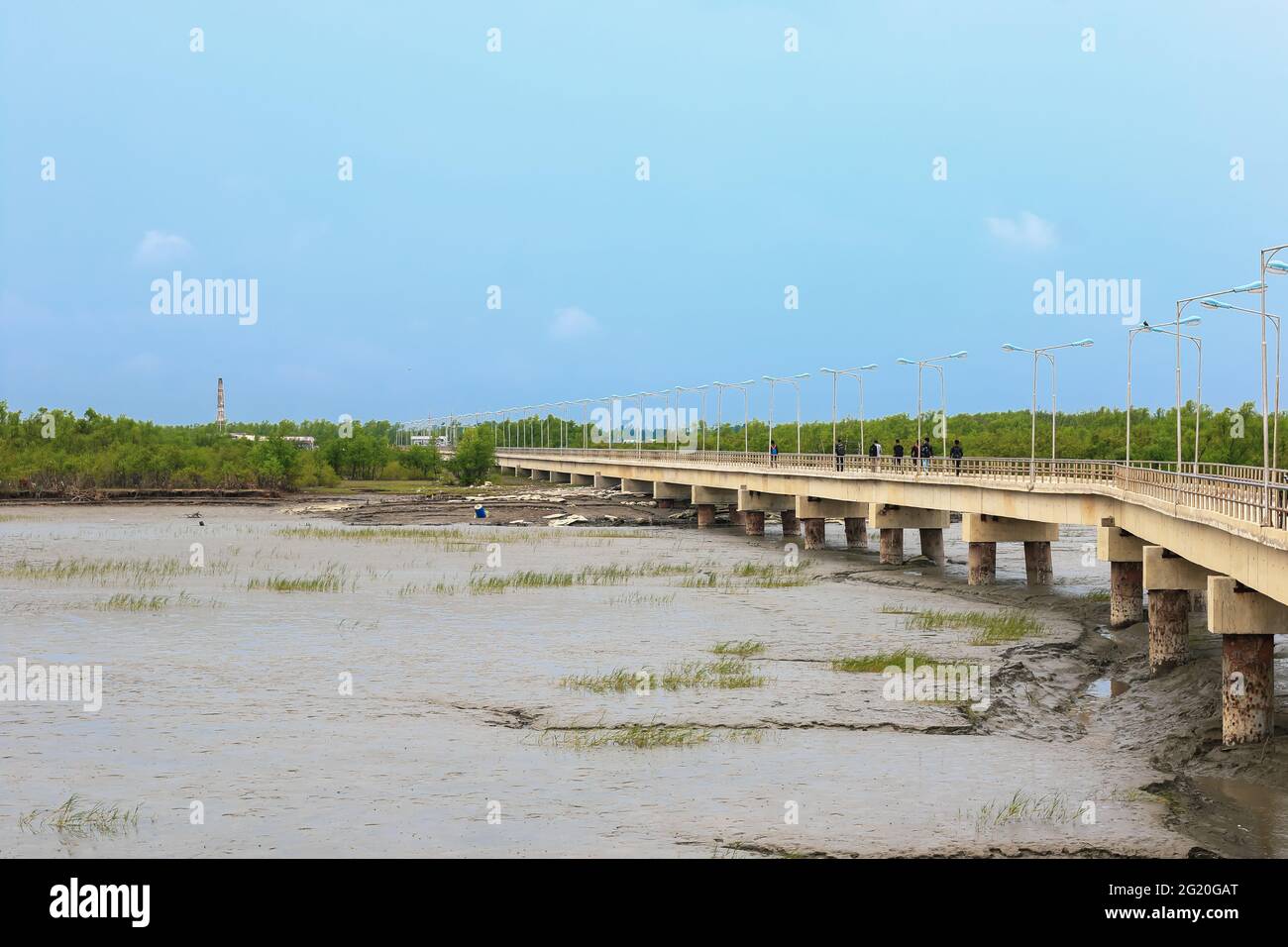 Pier or jetty, footpath promenade, and sea at sunrise. Beautiful view ...
