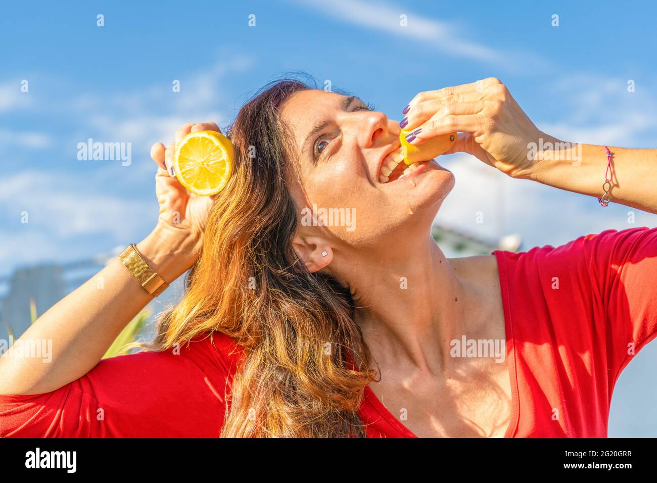Woman hands face lemons hi-res stock photography and images - Alamy