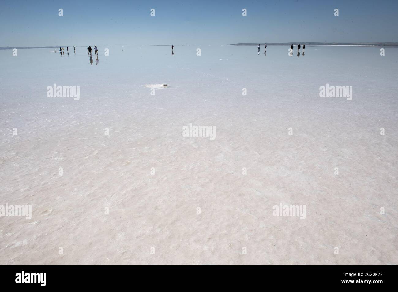 People walk in Salt Lake (Turkish: Tuz Golu), near Cappadocia, Turkey ...