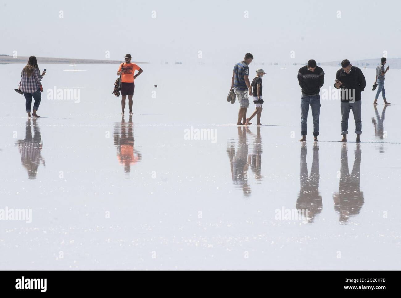 People walk in Salt Lake (Turkish: Tuz Golu), near Cappadocia, Turkey ...
