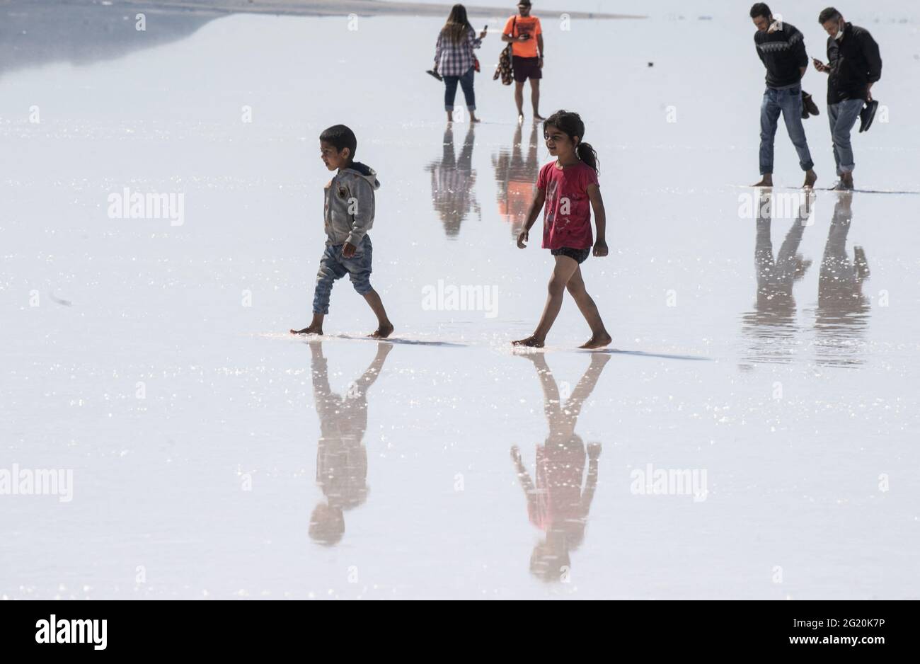 People walk in Salt Lake (Turkish: Tuz Golu), near Cappadocia, Turkey ...