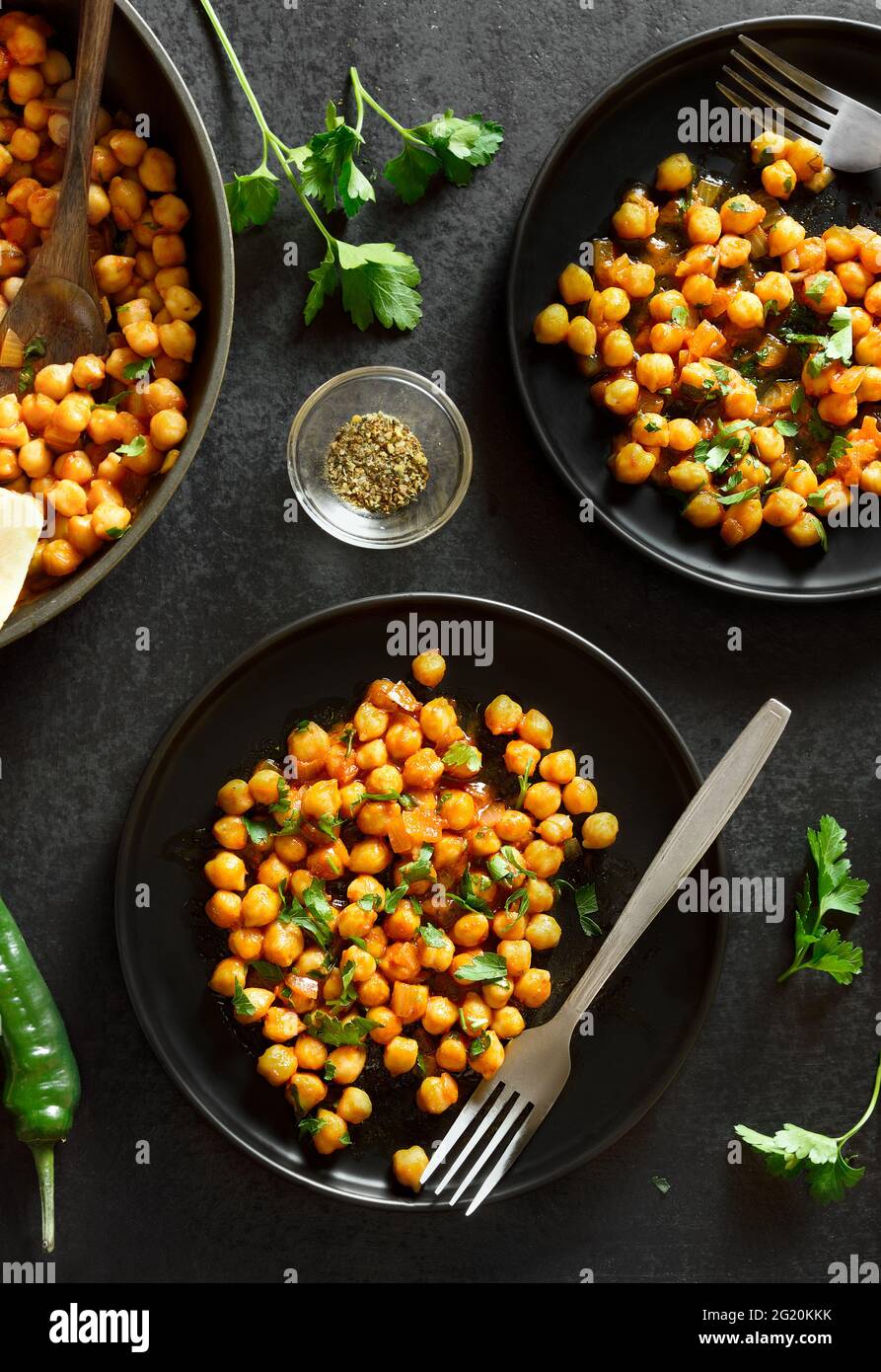 Indian style crispy roasted chickpeas over black stone background ...