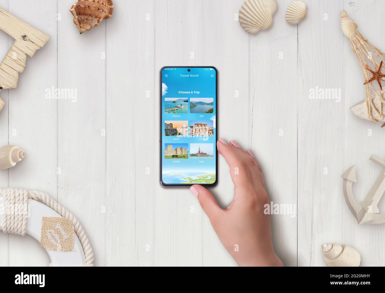 Smart phone on desk with travel destinations app. Plan a trip concept ...
