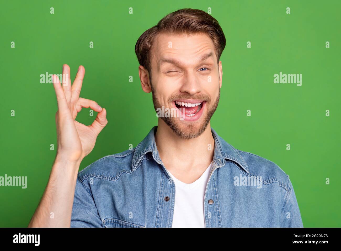 Photo portrait of man showing okay gesture smiling winking blinking ...