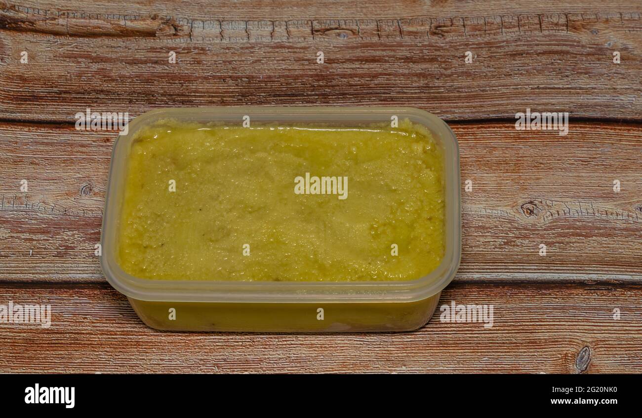 Marijuana butter on wooden table coffee gingerbread and green color ...