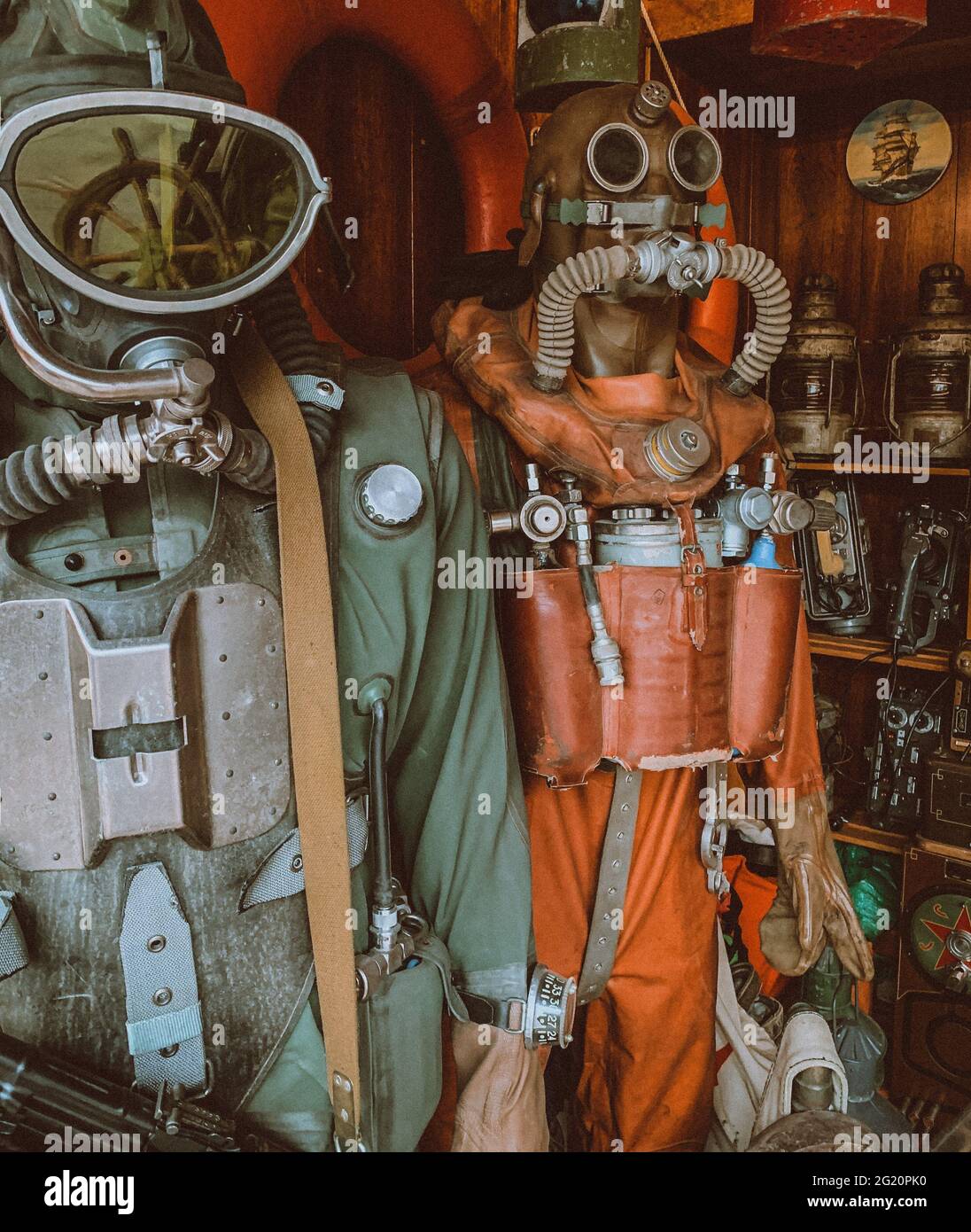 Vertical shot of old diving costumes in a wooden boat interior Stock ...