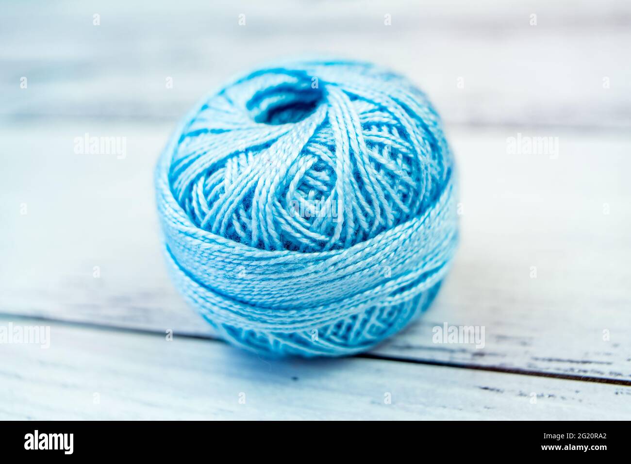 Closeup shot of a ball of blue yarn Stock Photo - Alamy
