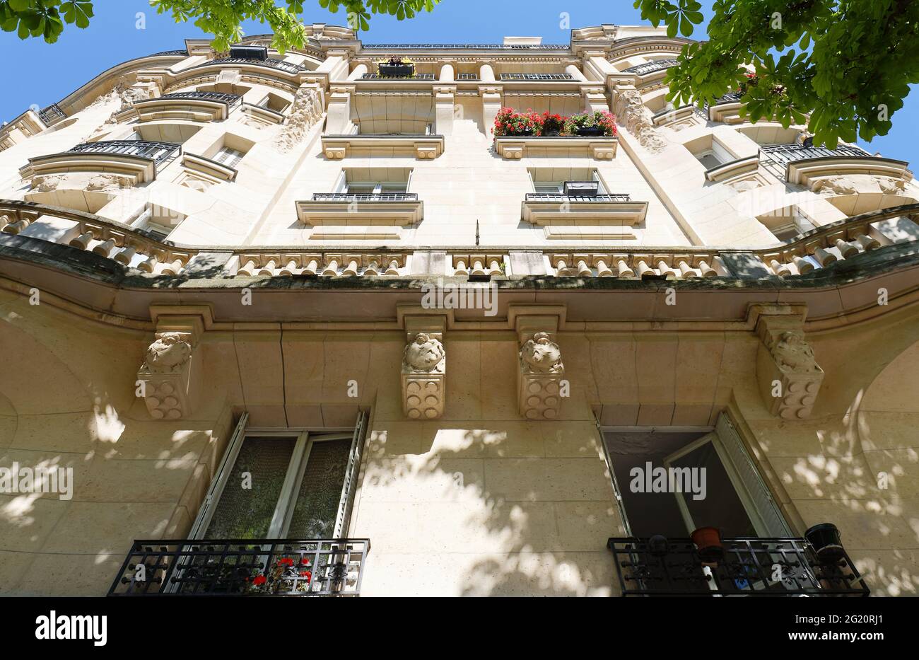 Traditional French house with typical balconies and windows. Paris ...