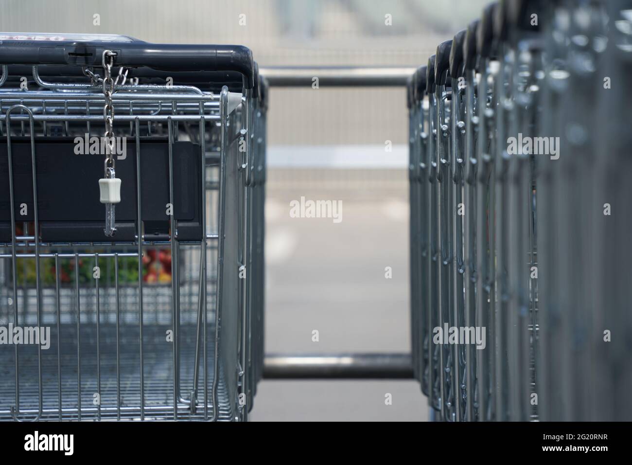 2 rows with shopping carts. Chain from deposit lock hangs down ...