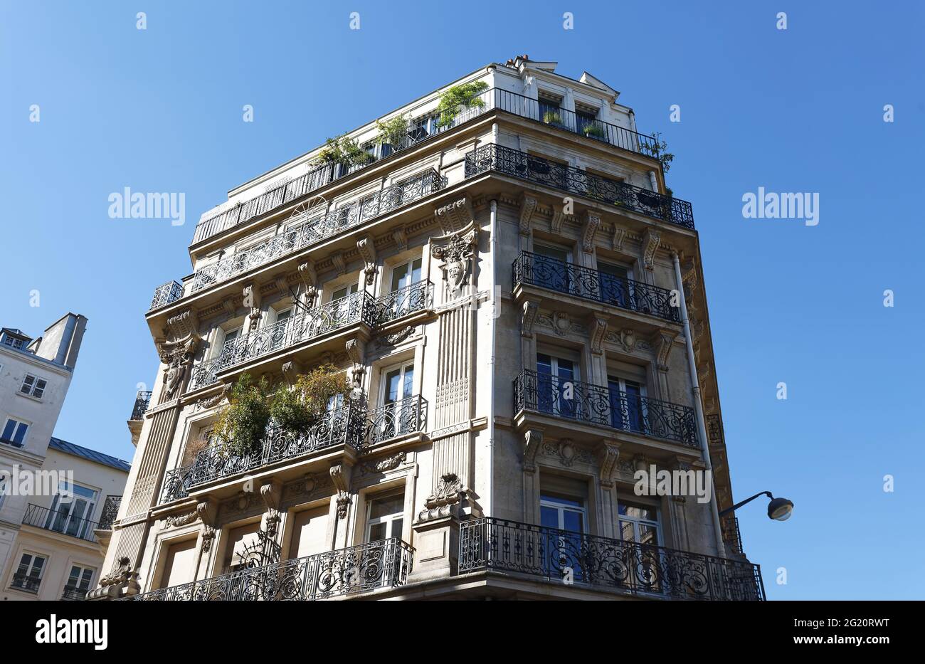 Traditional French house with typical balconies and windows. Paris ...