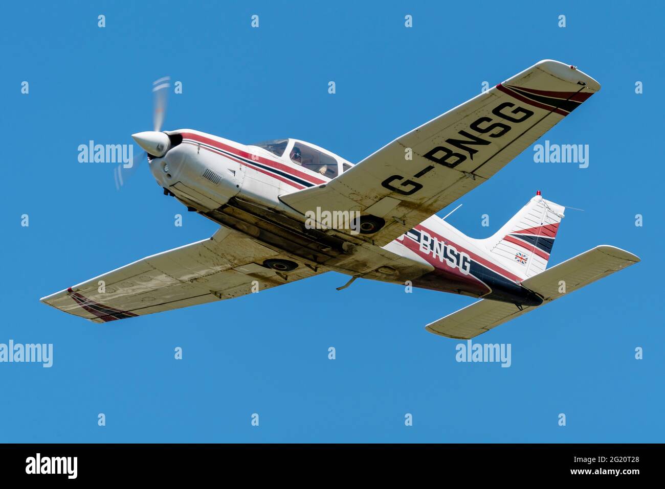 1978 Piper PA-28 Cherokee Arrow III plane flying in clear blue sky over ...