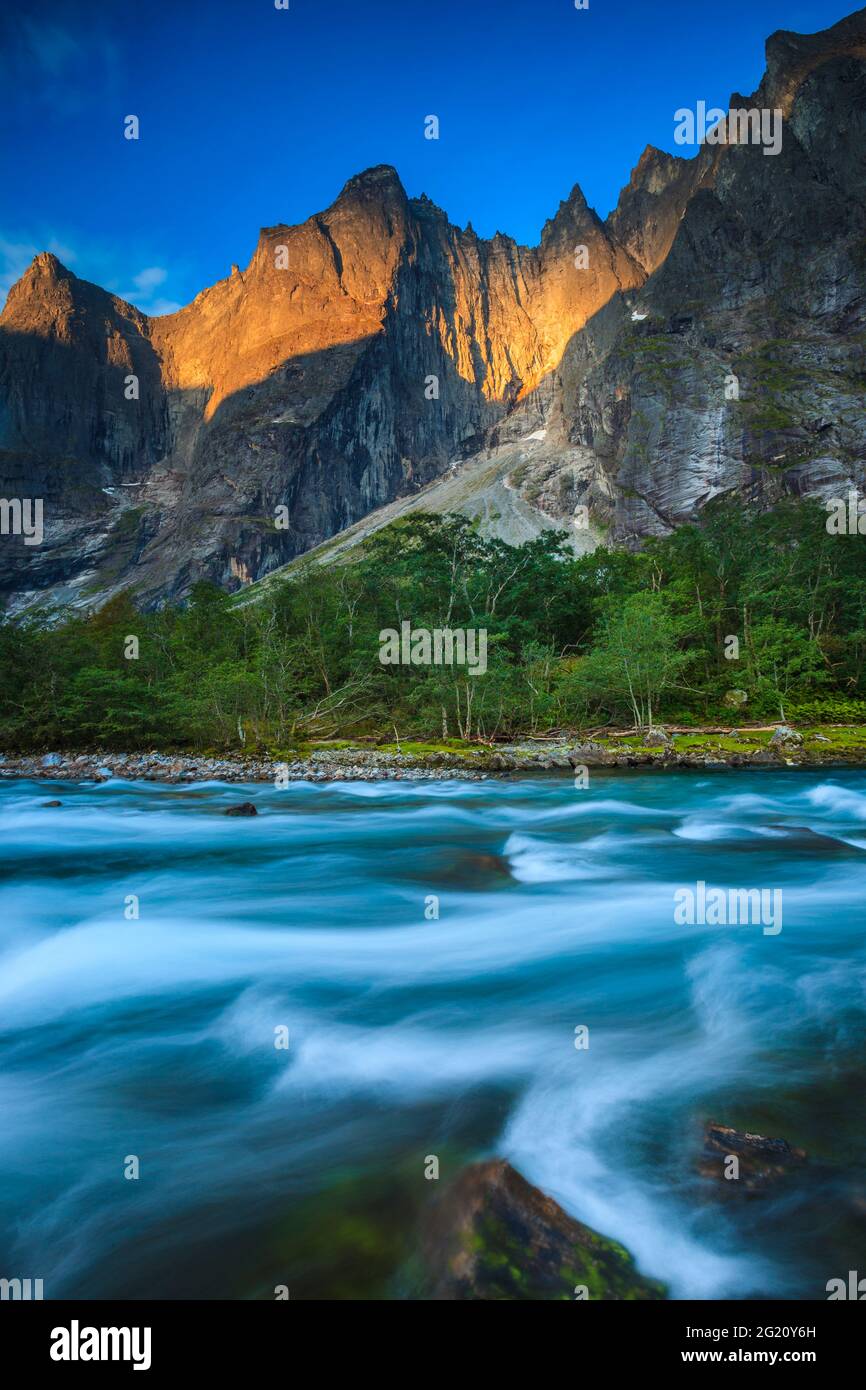 Early autumn morning sunlight on Trollveggen, or the Troll Wall, and ...