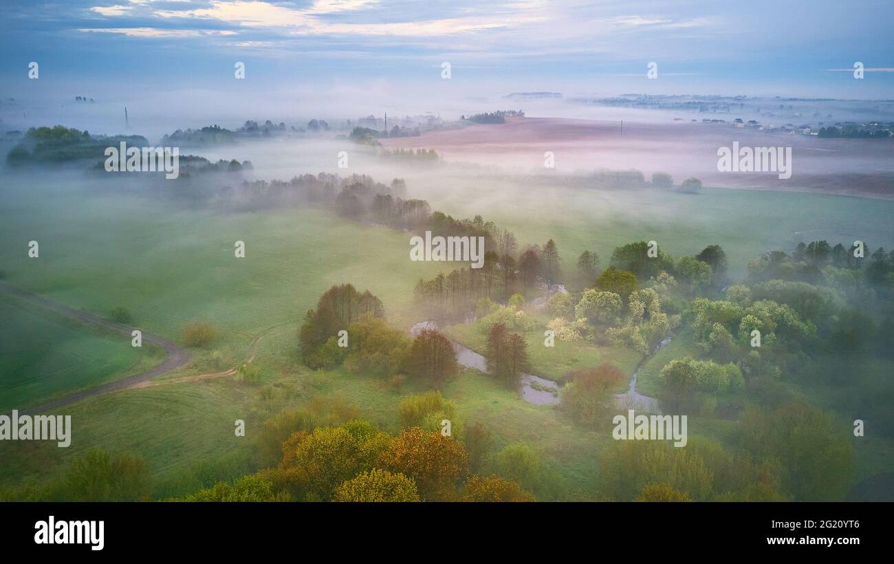 Summer cloudy rainy foggy morning panorama. Rural misty river, fields ...