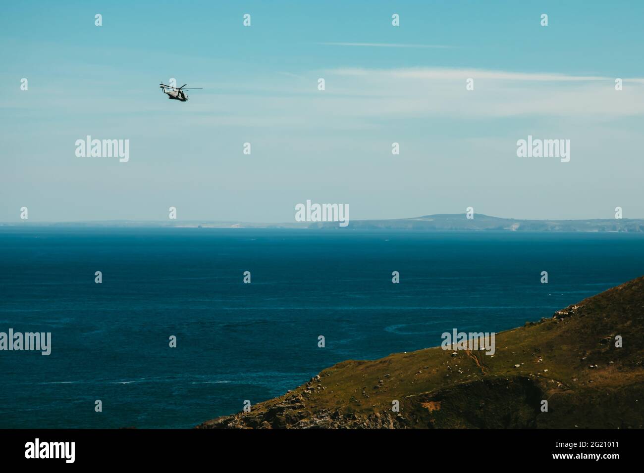 Royal Navy Merlin Helicopter arriving for G7 summit flying over coast ...