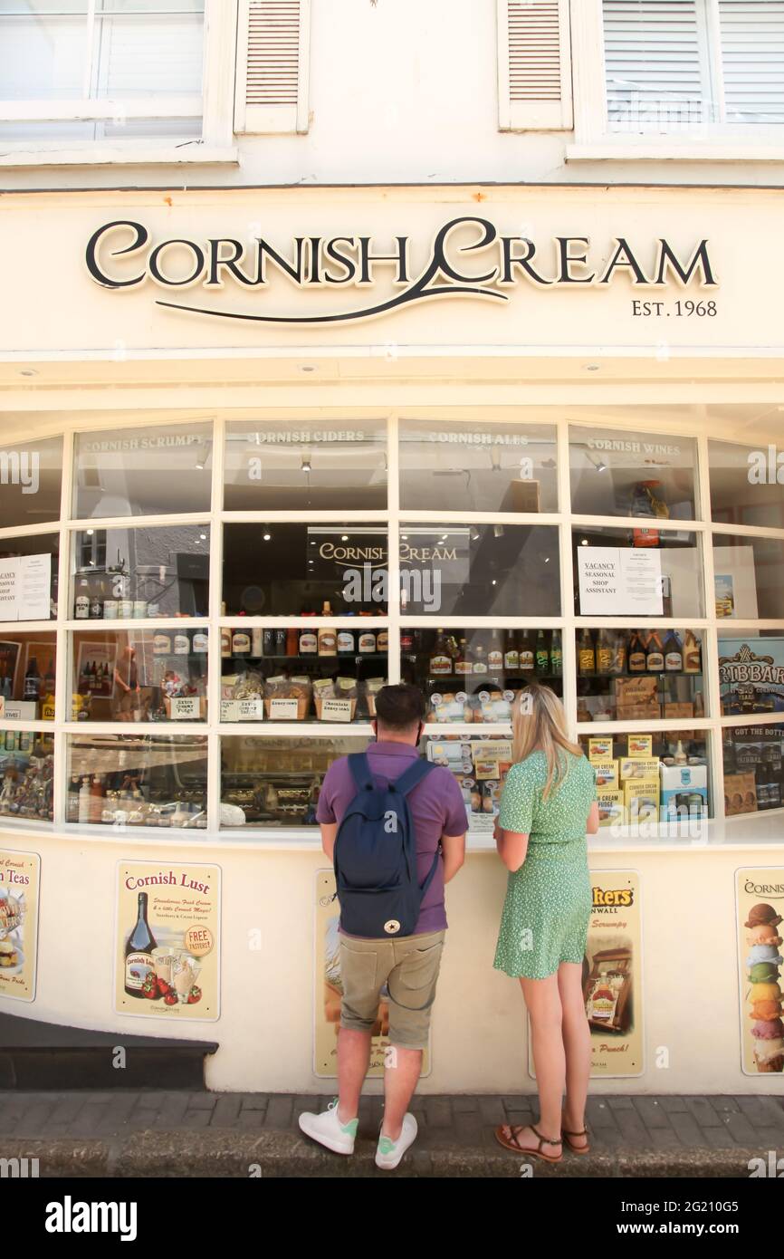 People looking in window of Cornish Cream fudge shop, Fore Street, St ...