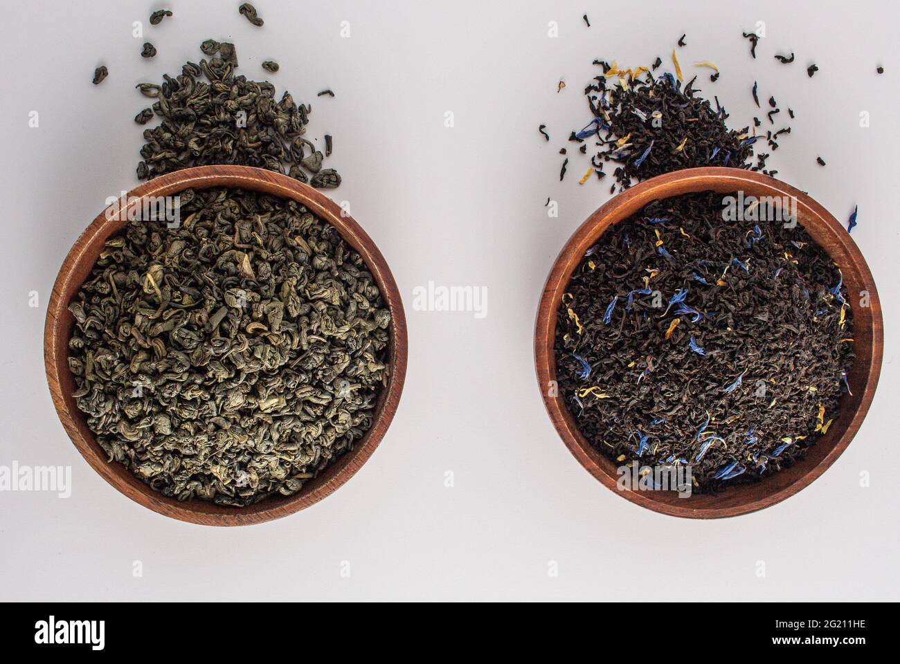 Gunpowder green tea and Earl grey tea leaves wooden bowls Stock Photo ...