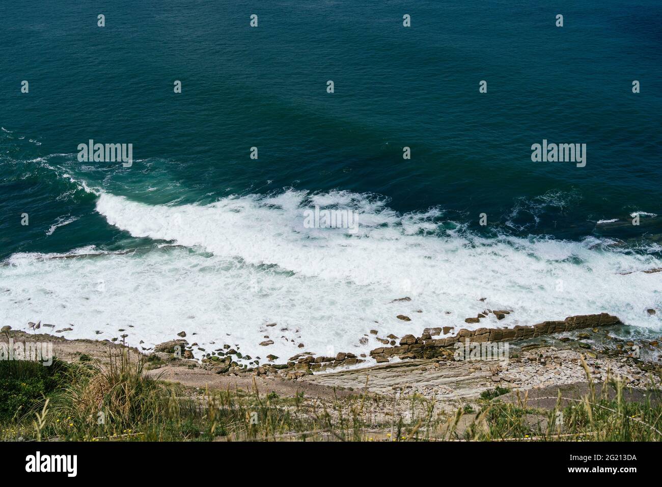 rocky cliff from which to see the blue sea in summer afternoon Stock ...