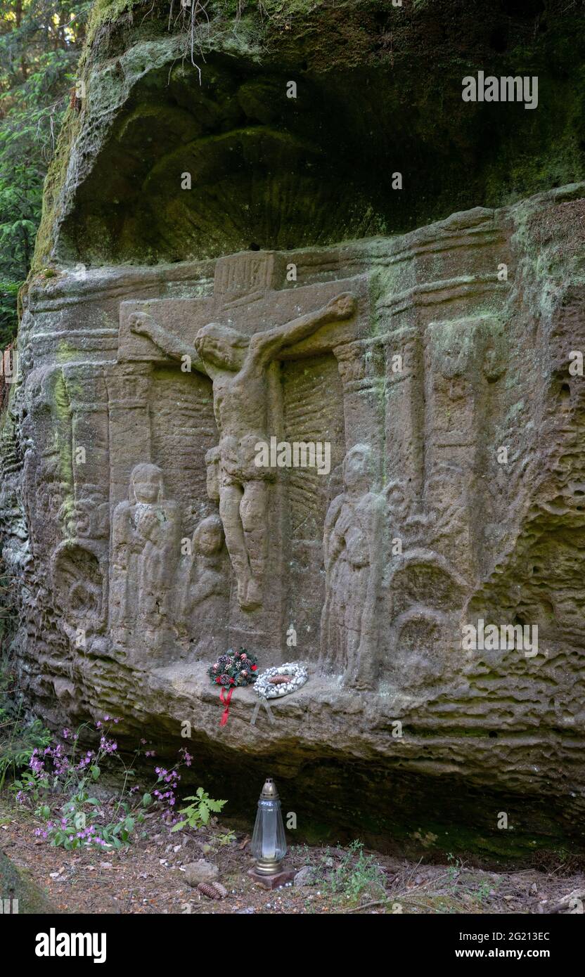 Historic folk relief of Crucifixion carved into face of a sandstone ...