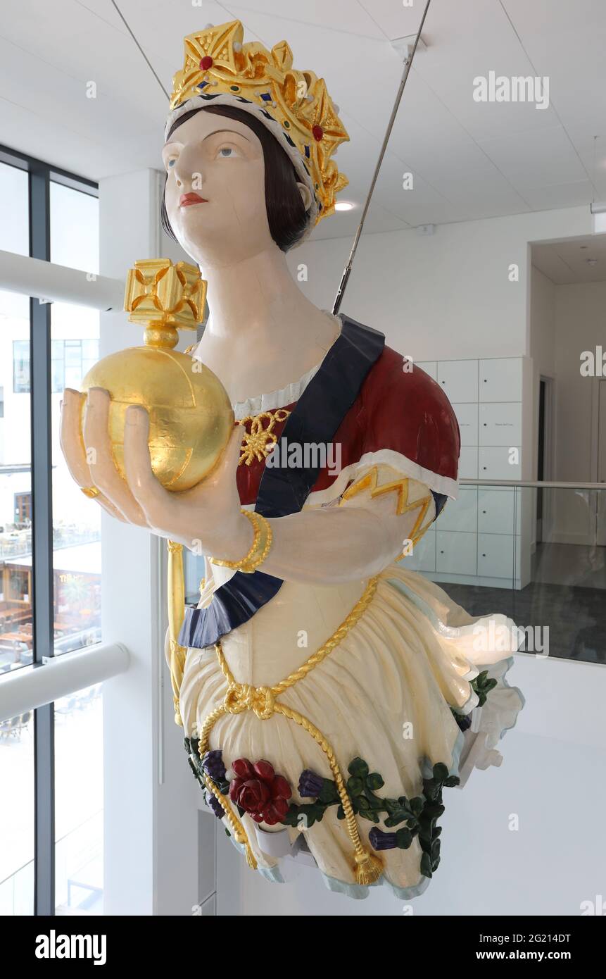 Restored ships' carved, naval wooden figureheads, flying high in the ...