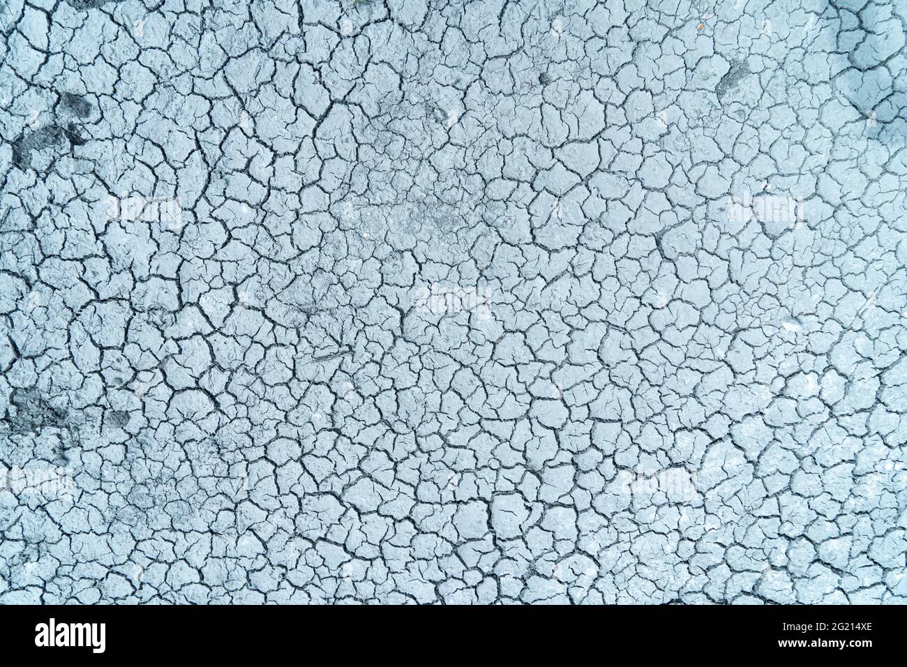 Mudflat cracked desert barren surface for natural background, layer, wallpaper, photo effect ...