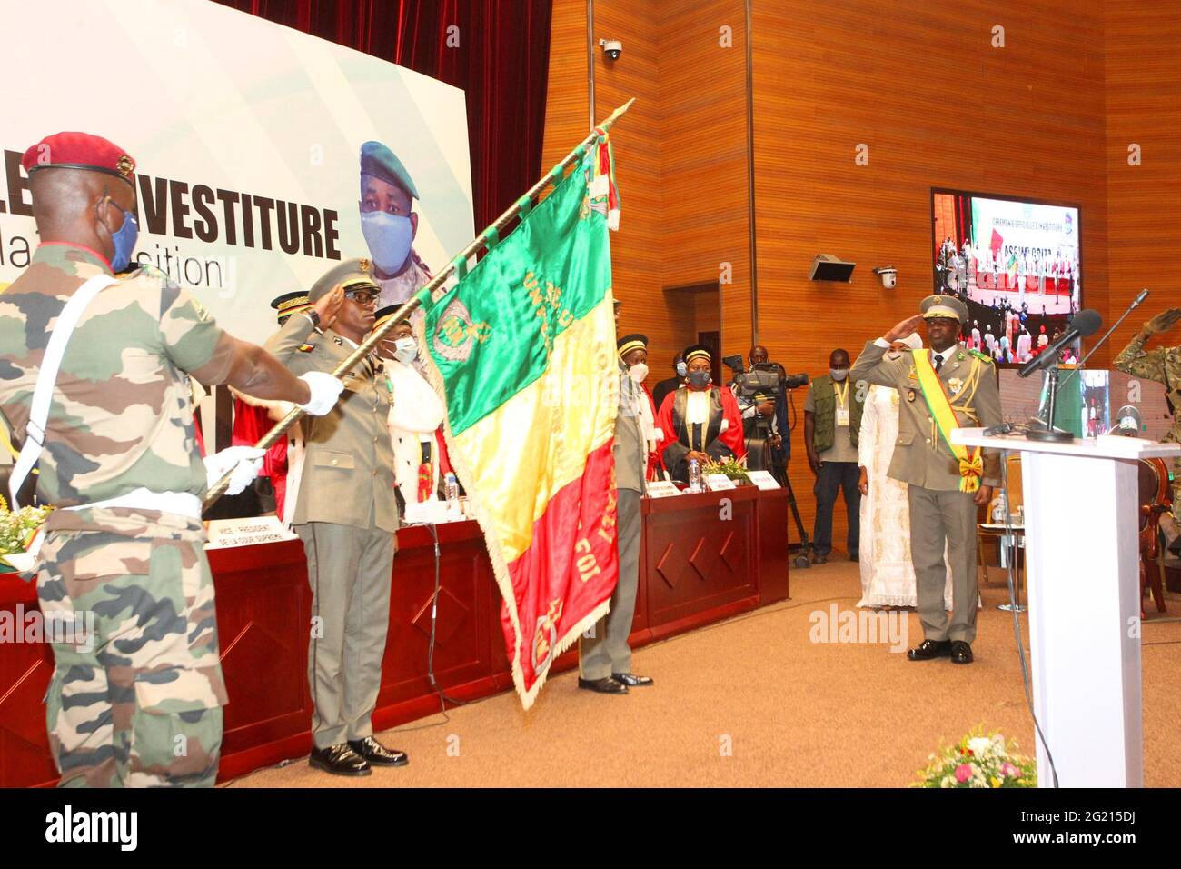 Bamako, Mali. 7th June, 2021. Assimi Goita (1st R) salutes the flag of ...