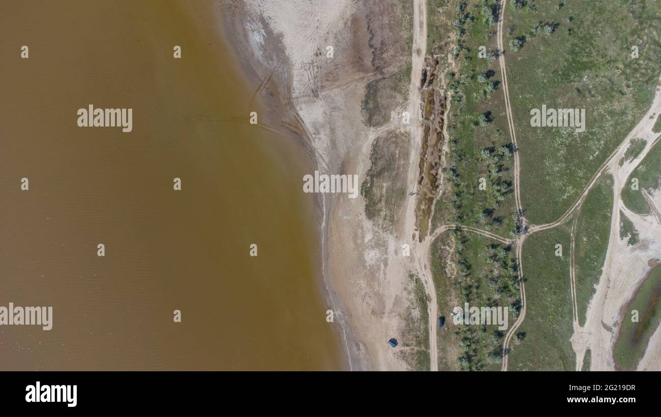The bottom of a dried up salt lake. View from the air. Traces of cars ...