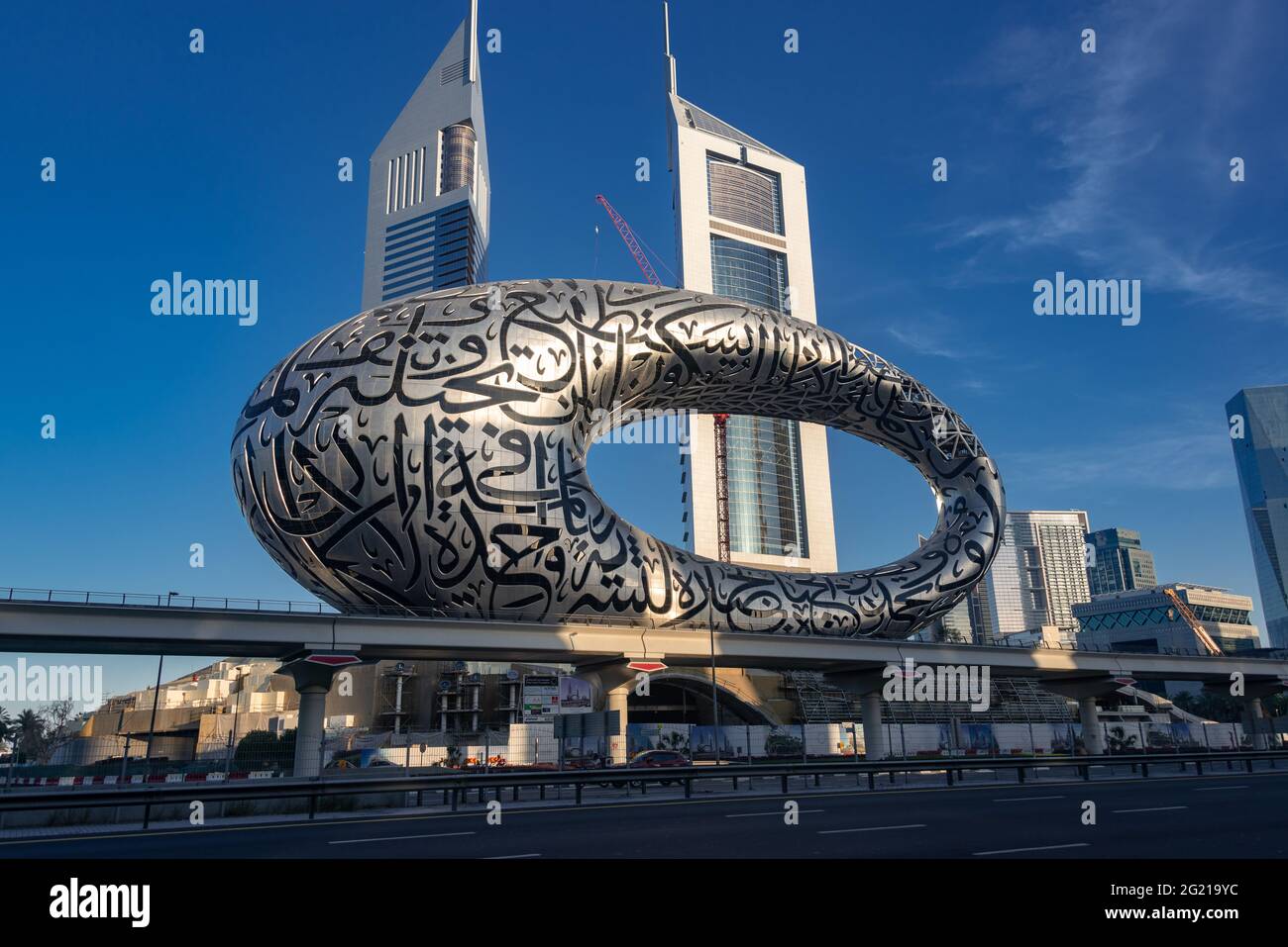 City scape from Dubai with Museum of the Future and Emirates Towers in ...