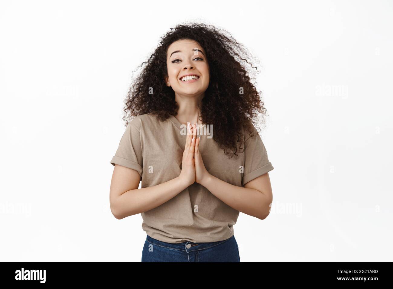 Smiling cute brunette woman asking for help, beg for favour, looking ...