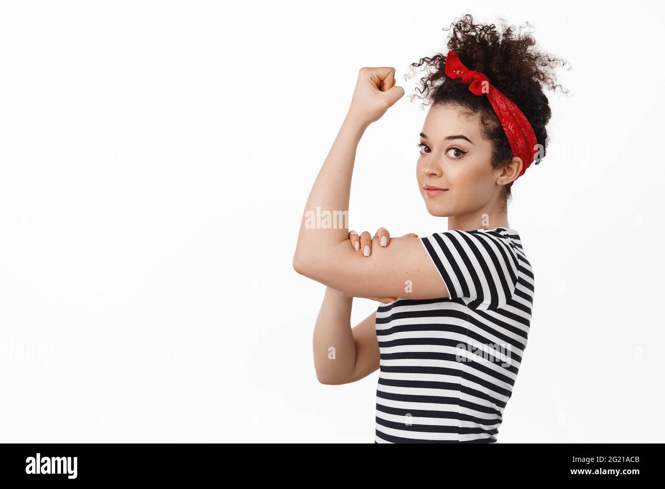 Women muscle strength showing biceps hi-res stock photography and ...