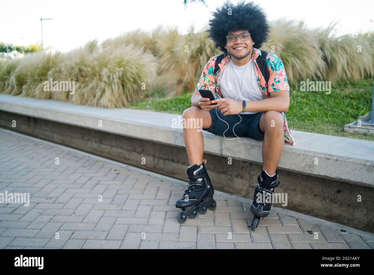 Portrait walking young man headphones hi-res stock photography and ...