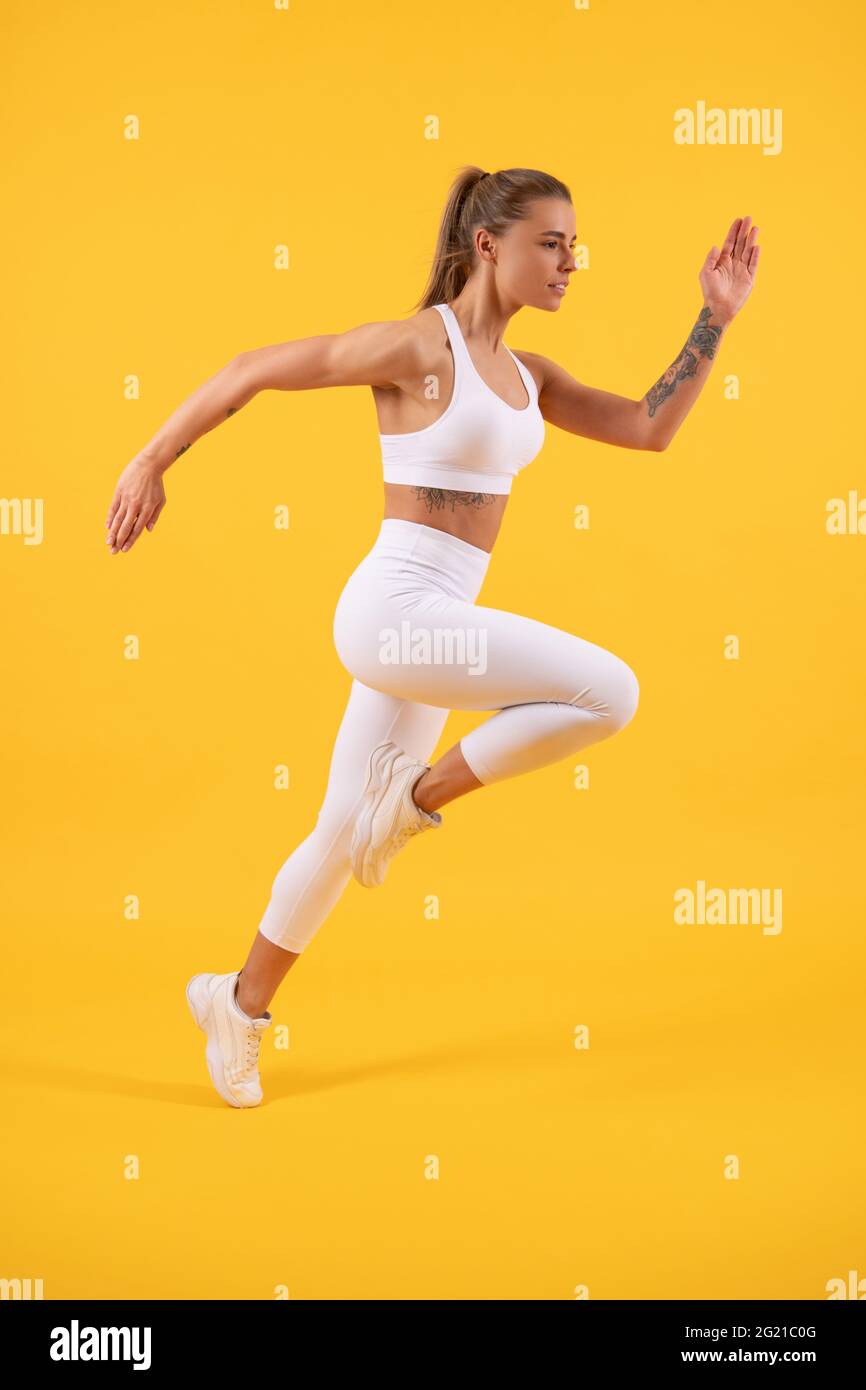 Female sprinter running track hi-res stock photography and images - Alamy