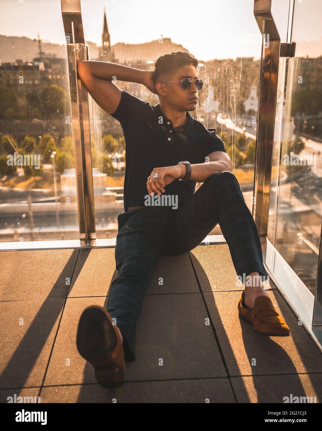 Guy sitting in balcony hi-res stock photography and images - Alamy