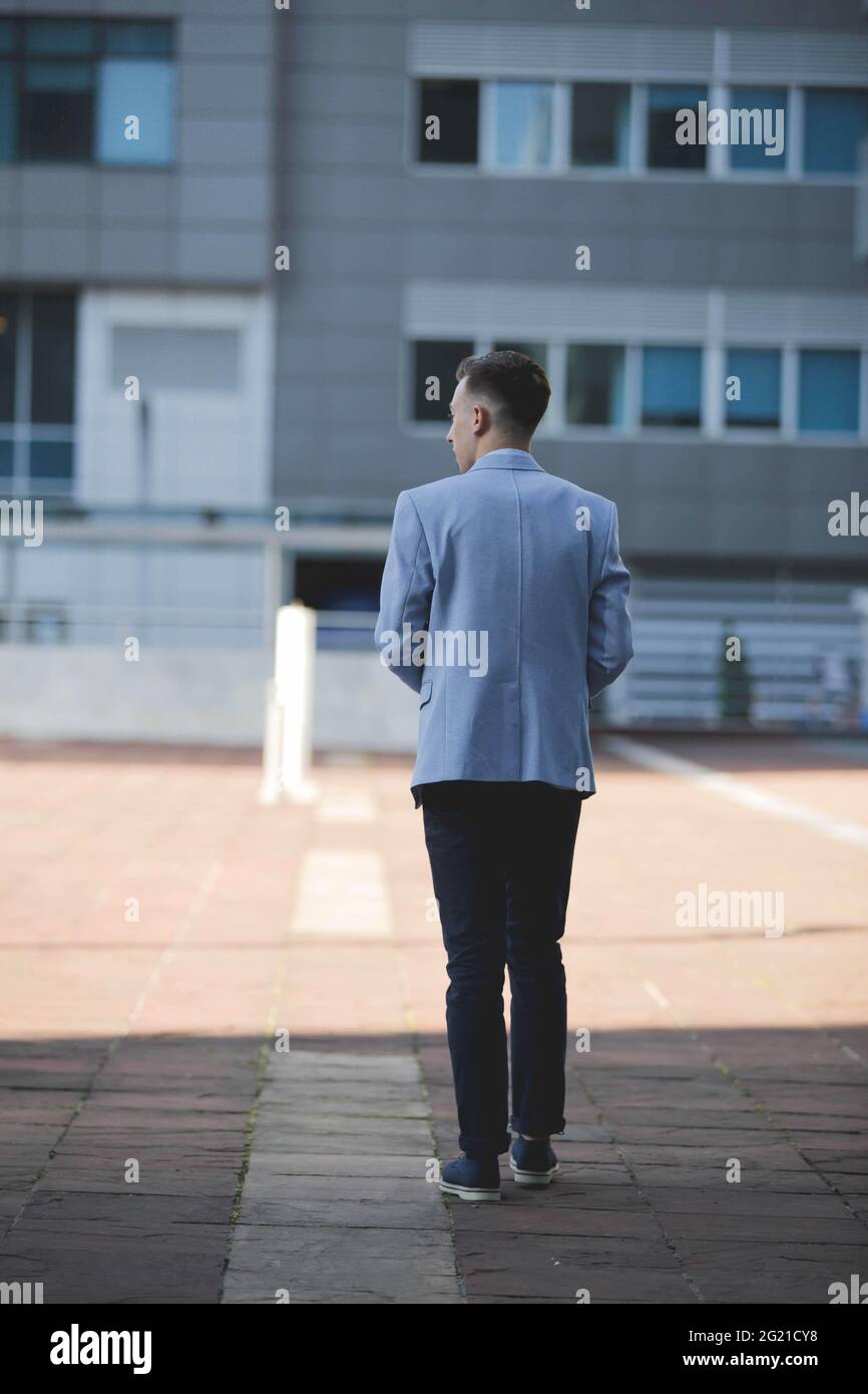 Man walking suit from behind hi-res stock photography and images - Alamy