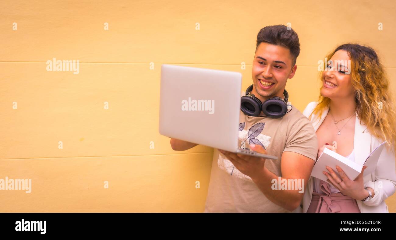 Young entrepreneur couple doing teamwork with a computer against a ...