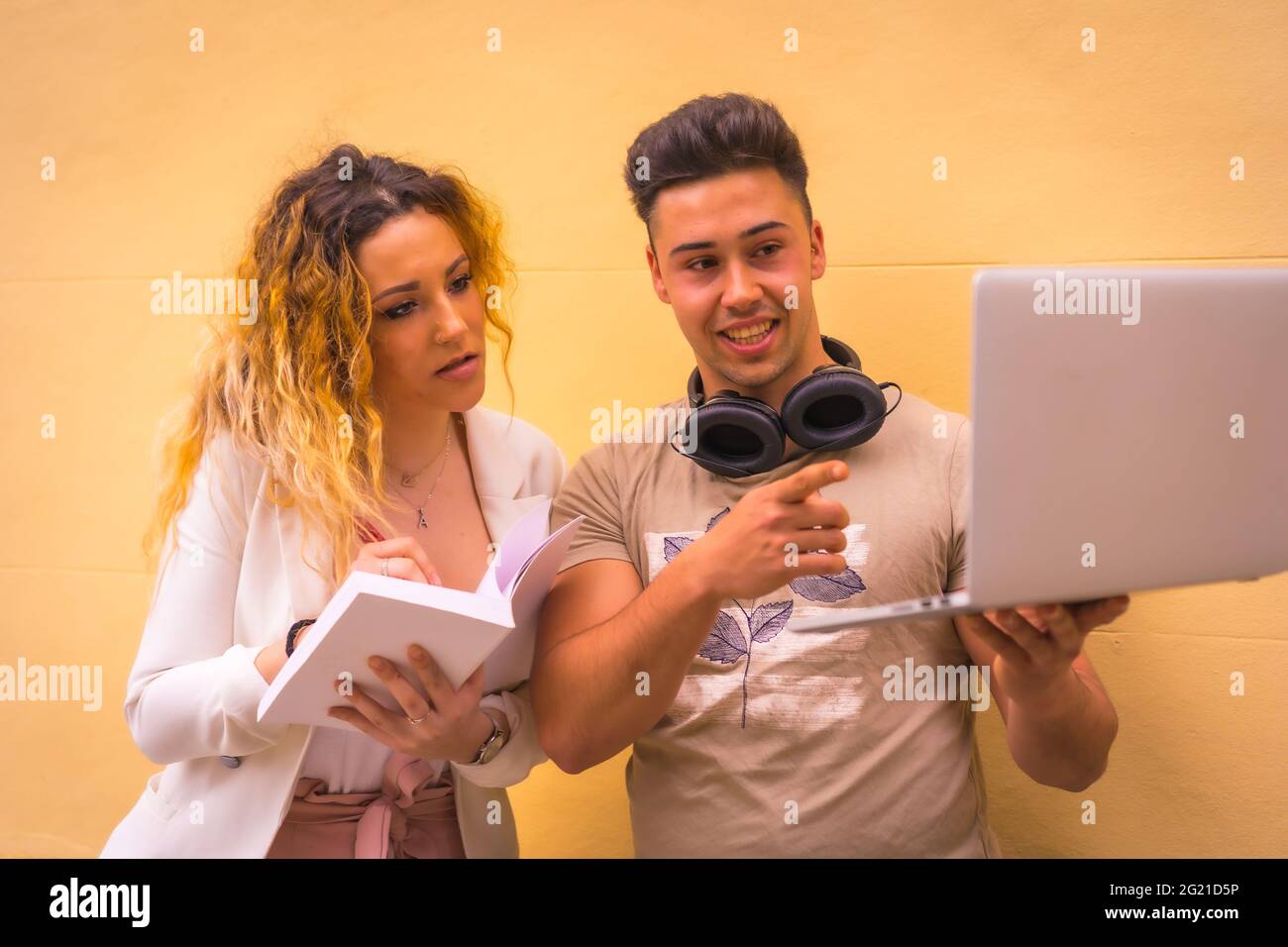 Young entrepreneur couple doing teamwork with a computer against a ...