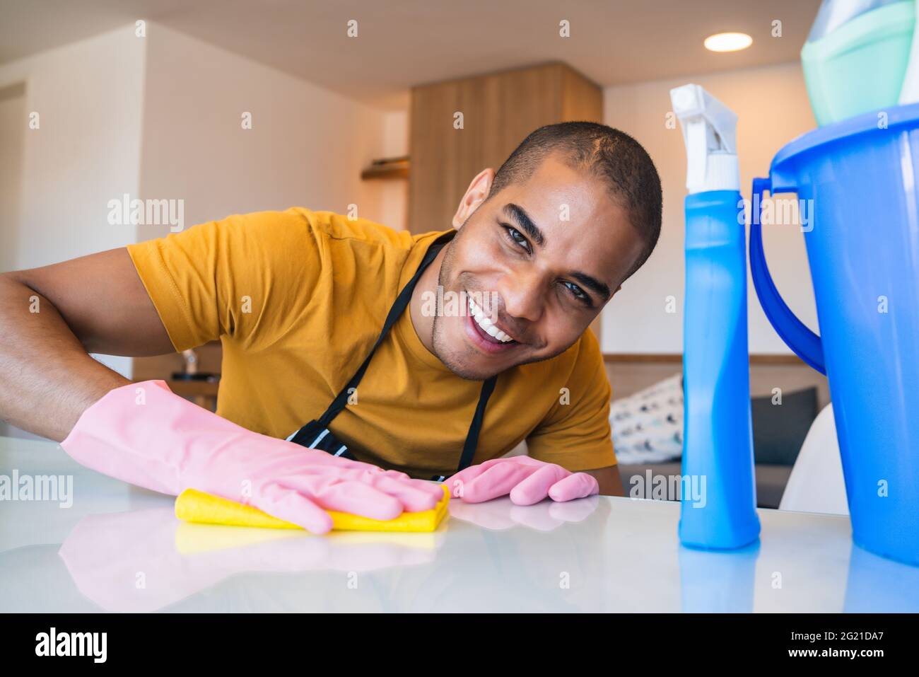 Positive young man cleaning hi-res stock photography and images - Alamy