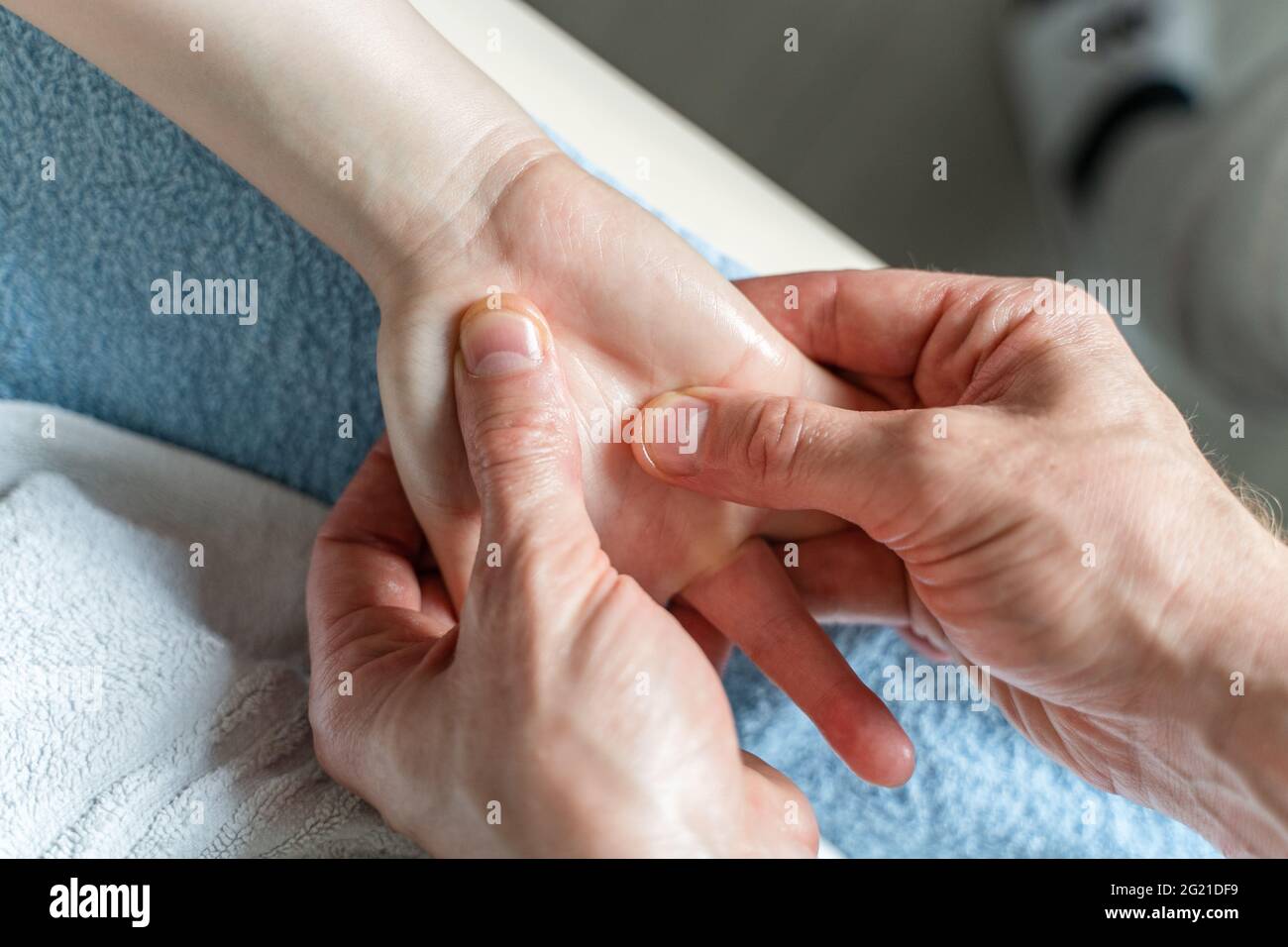 Woman massaging man hand hi-res stock photography and images - Alamy